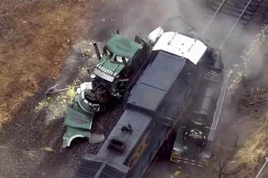 Watch the Aftermath of a Freight Train That Hit a Tanker Truck Filled ...