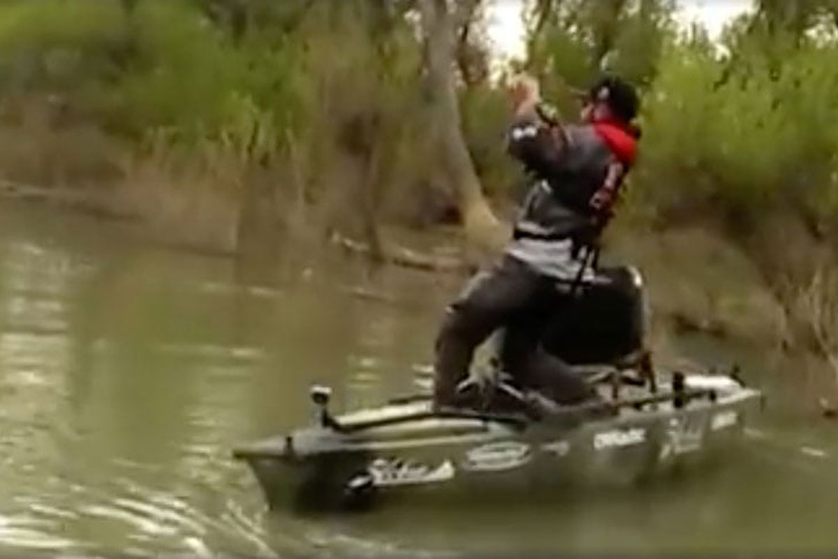 Pro Angler Lands Trophy Fish While Standing on Kayak - Wide Open Spaces