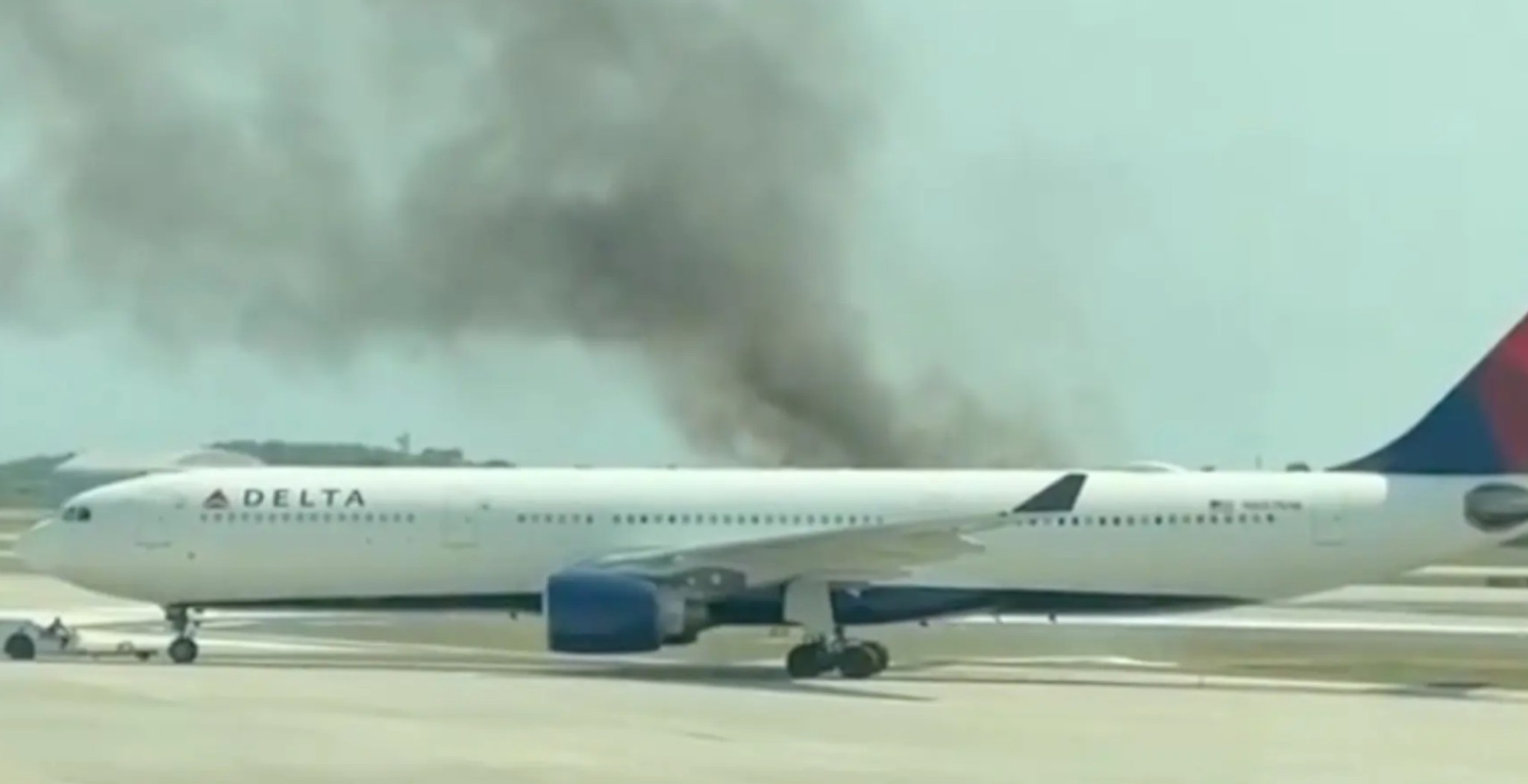 300 Passengers Evacuate After Delta Flight Bursts Into Flames Before ...